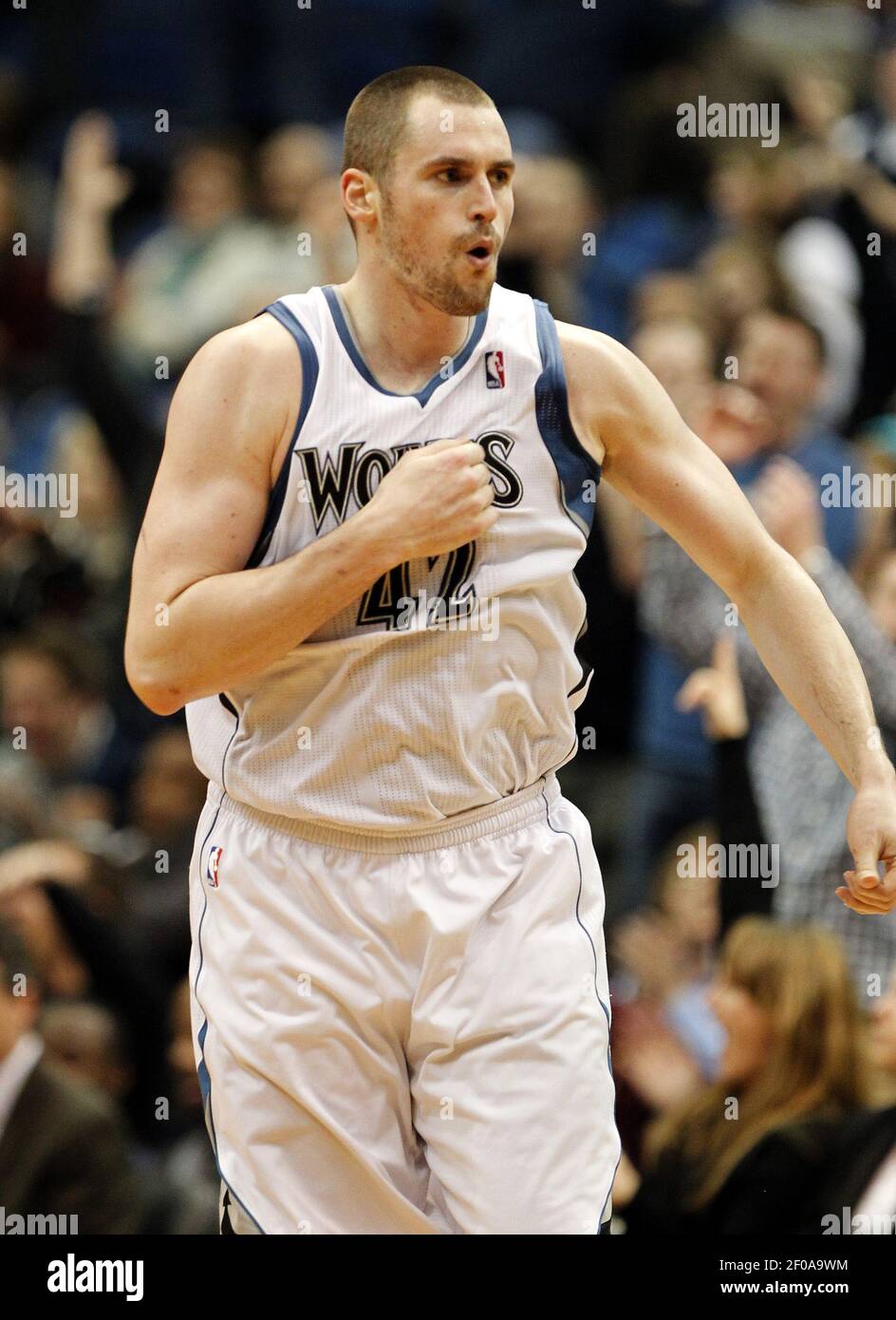 The Minnesota Timberwolves' Kevin Love (42) reacts after he scored on a ...