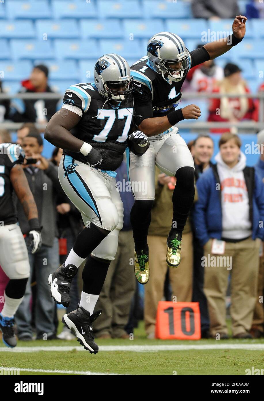 Carolina Panthers' Cam Newton (1) greets Byron Bell (77) with a jump ...