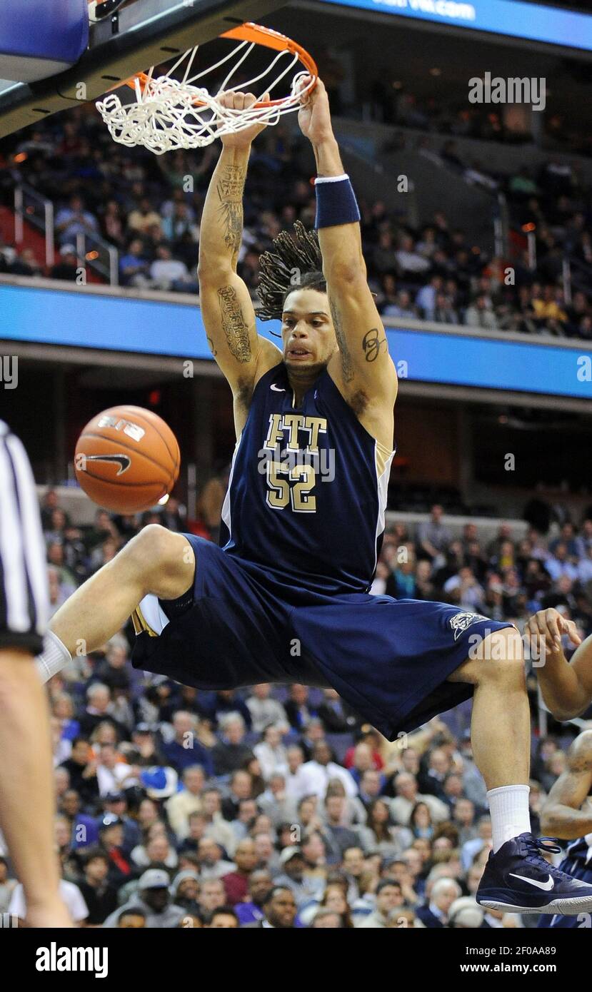 Pittsburgh center Gary McGhee (52) dunks against Georgetown during ...