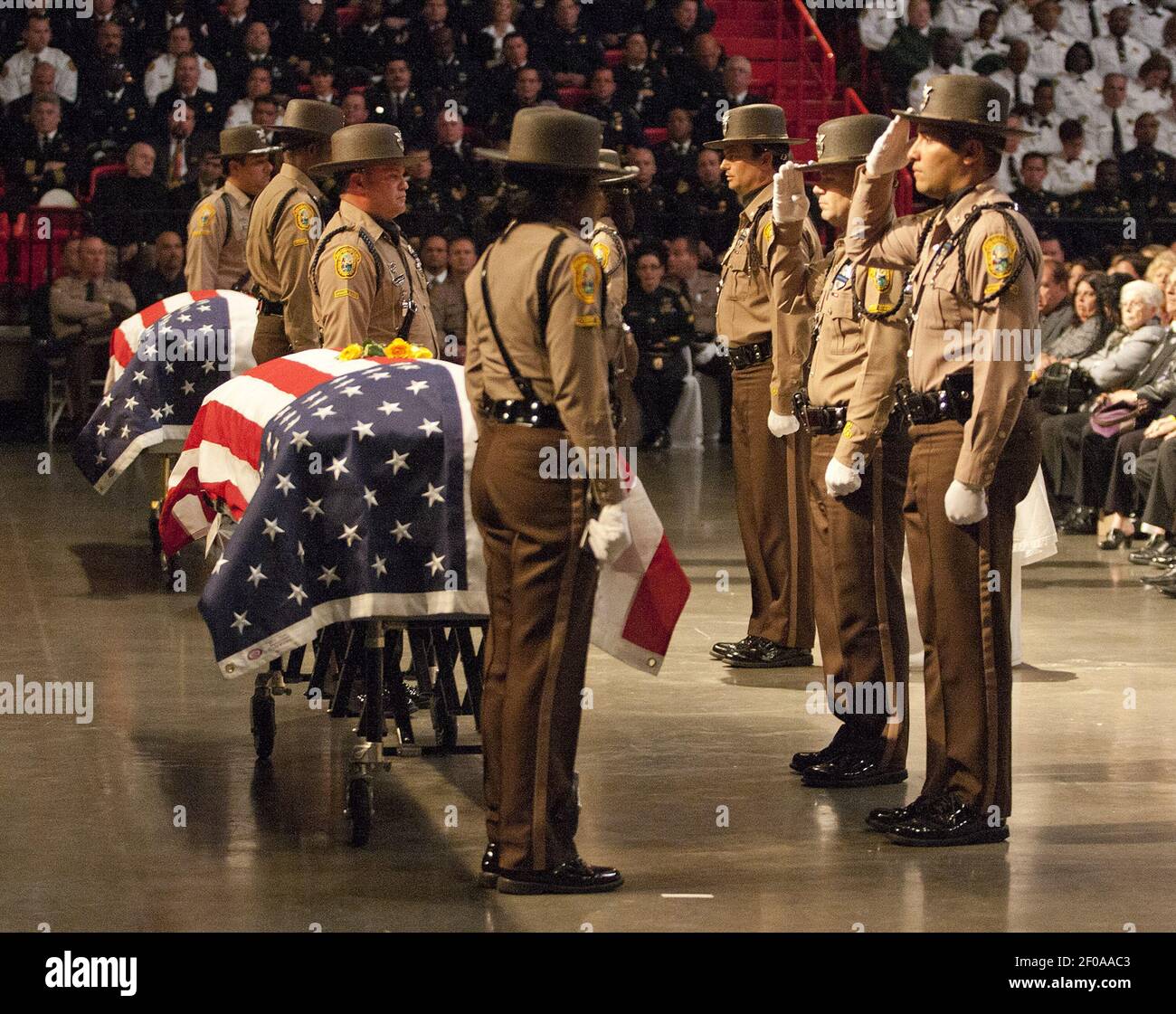 Honor Guard salutes their fallen comrades at the memorial service for ...