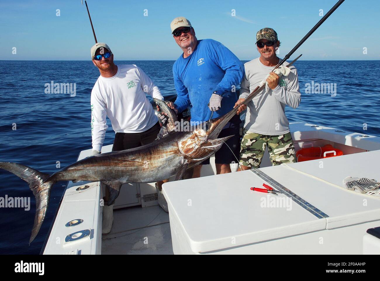 John Barfield, from left, Bobby Boyle and Jeff Walls show a swordfish ...