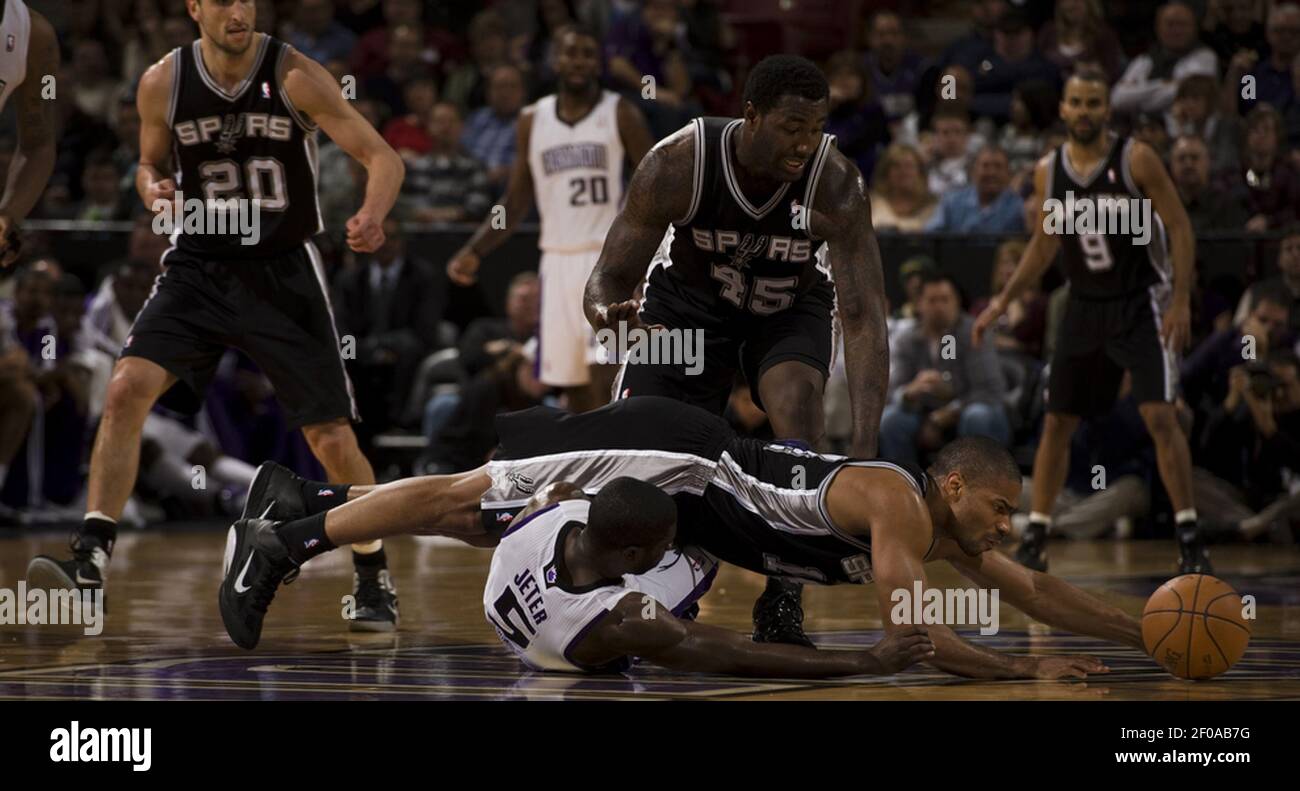 The San Antonio Spurs' Gary Neal dives over the Sacramento Kings ...
