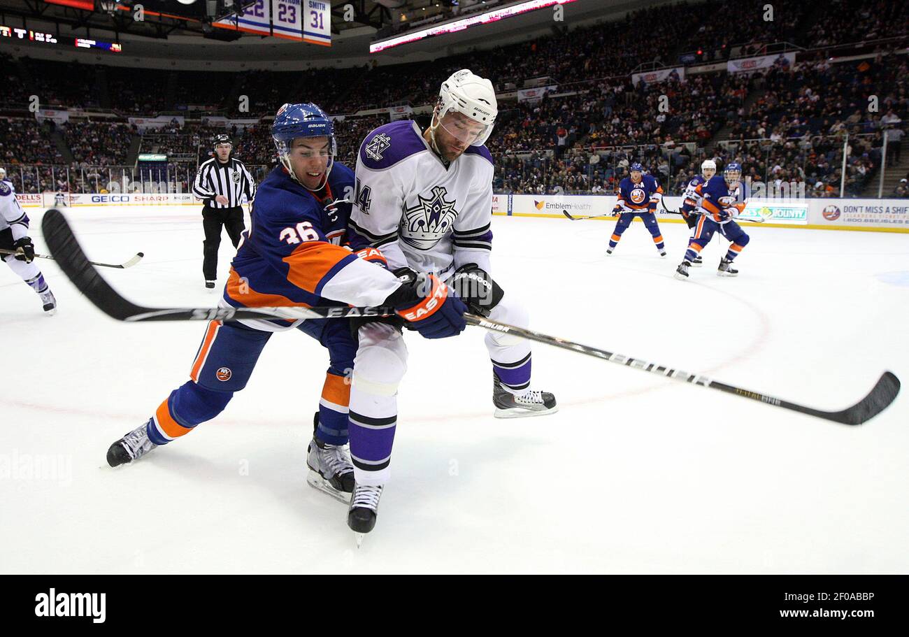 Travis Hamonic (36) of the New York Islanders defends against Justin ...