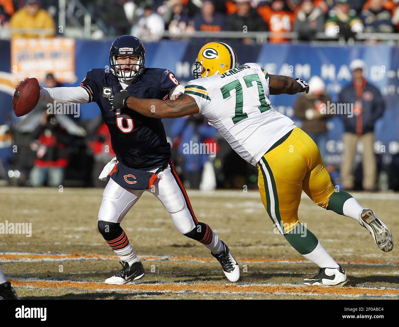 Chicago Bears quarterback Jay Cutler (6) is grabbed by Green Bay ...