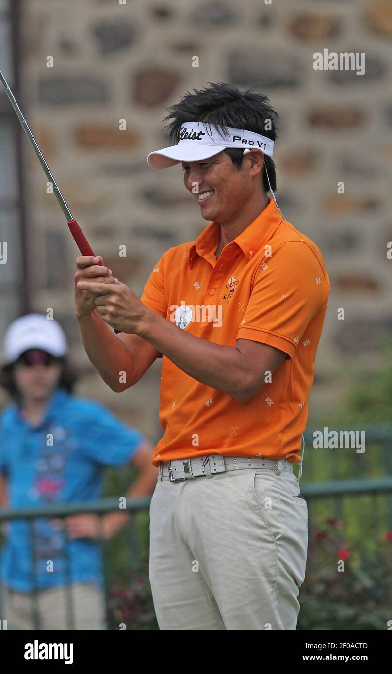 Ryuji Imada works on his putting grip on the practice green Wednesday ...