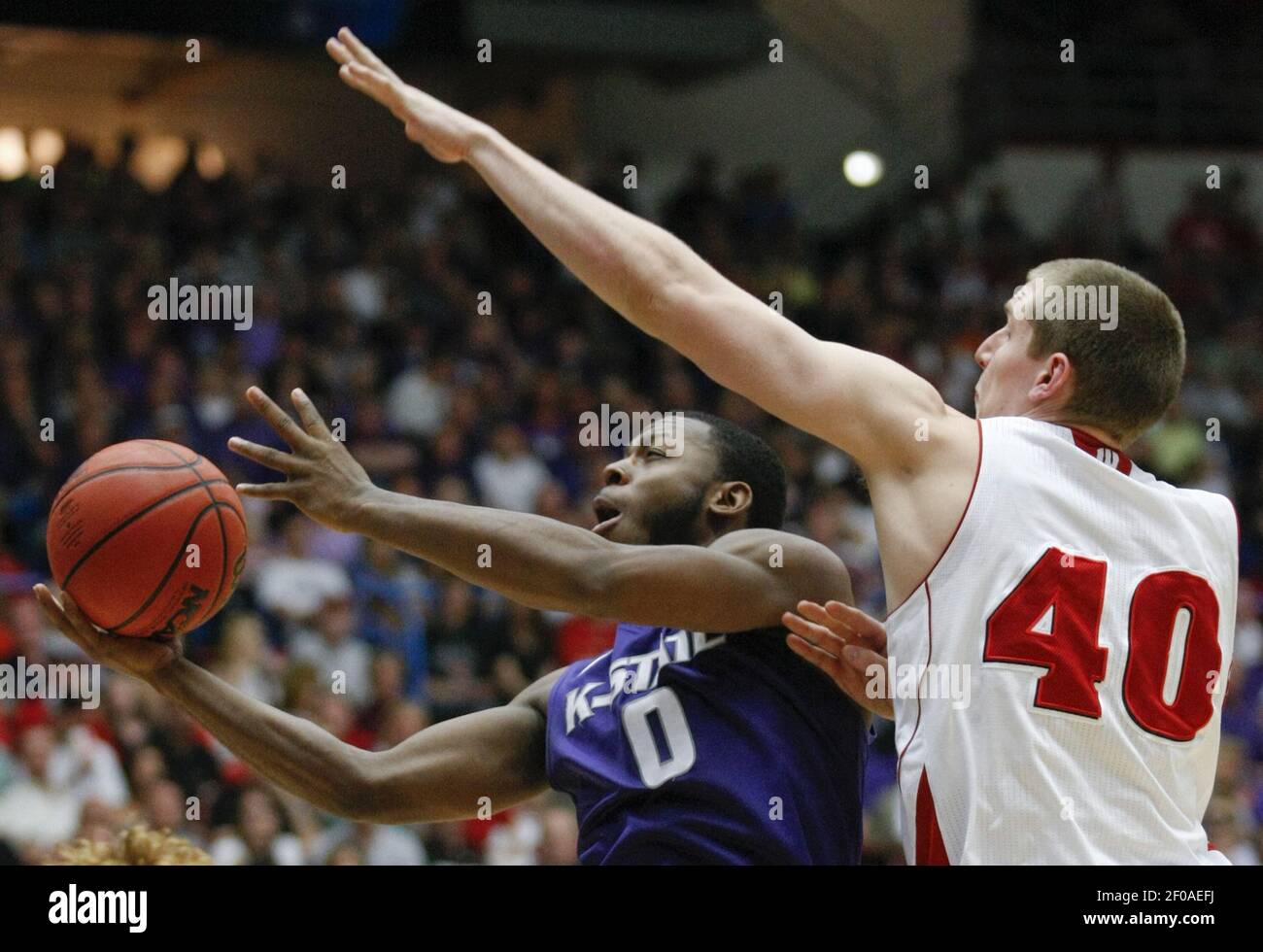 Kansas State's Jacob Pullen goes to the basket against Wisconsin's ...