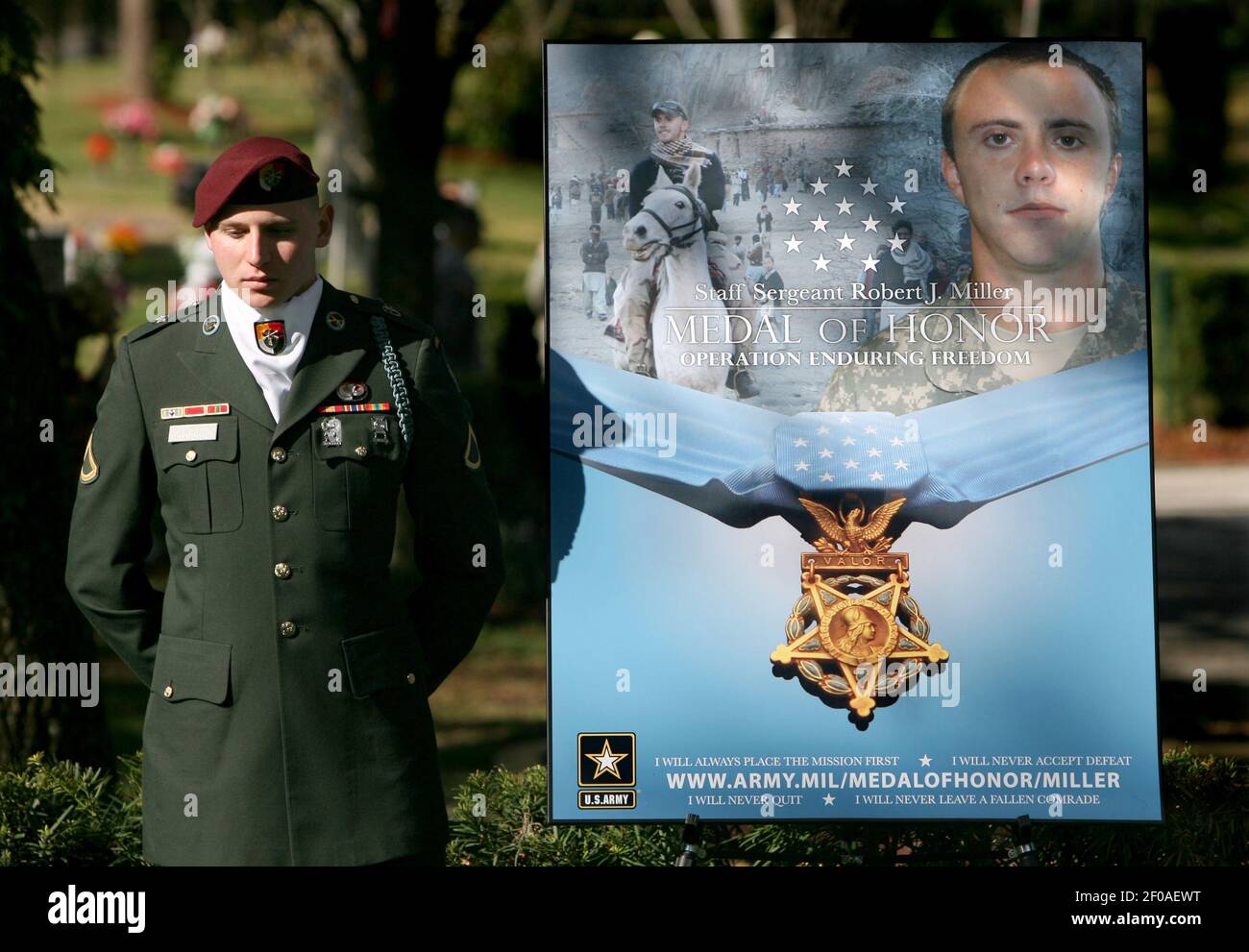 U.S. Army private 1st class Alexander Eliseev stands next to the a ...