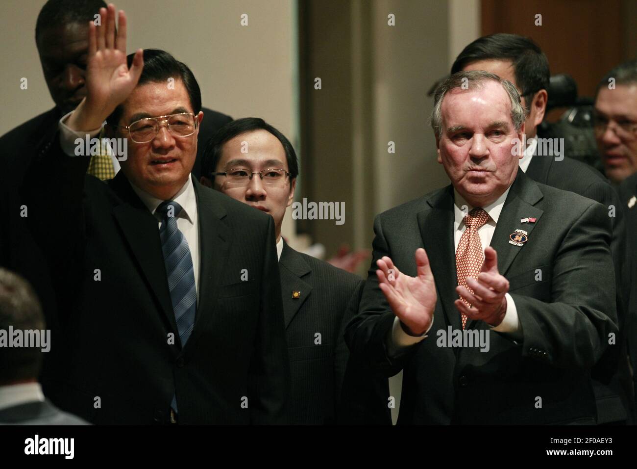 Chinese President Hu Jintao, left, waves goodbye Friday, January 21 ...