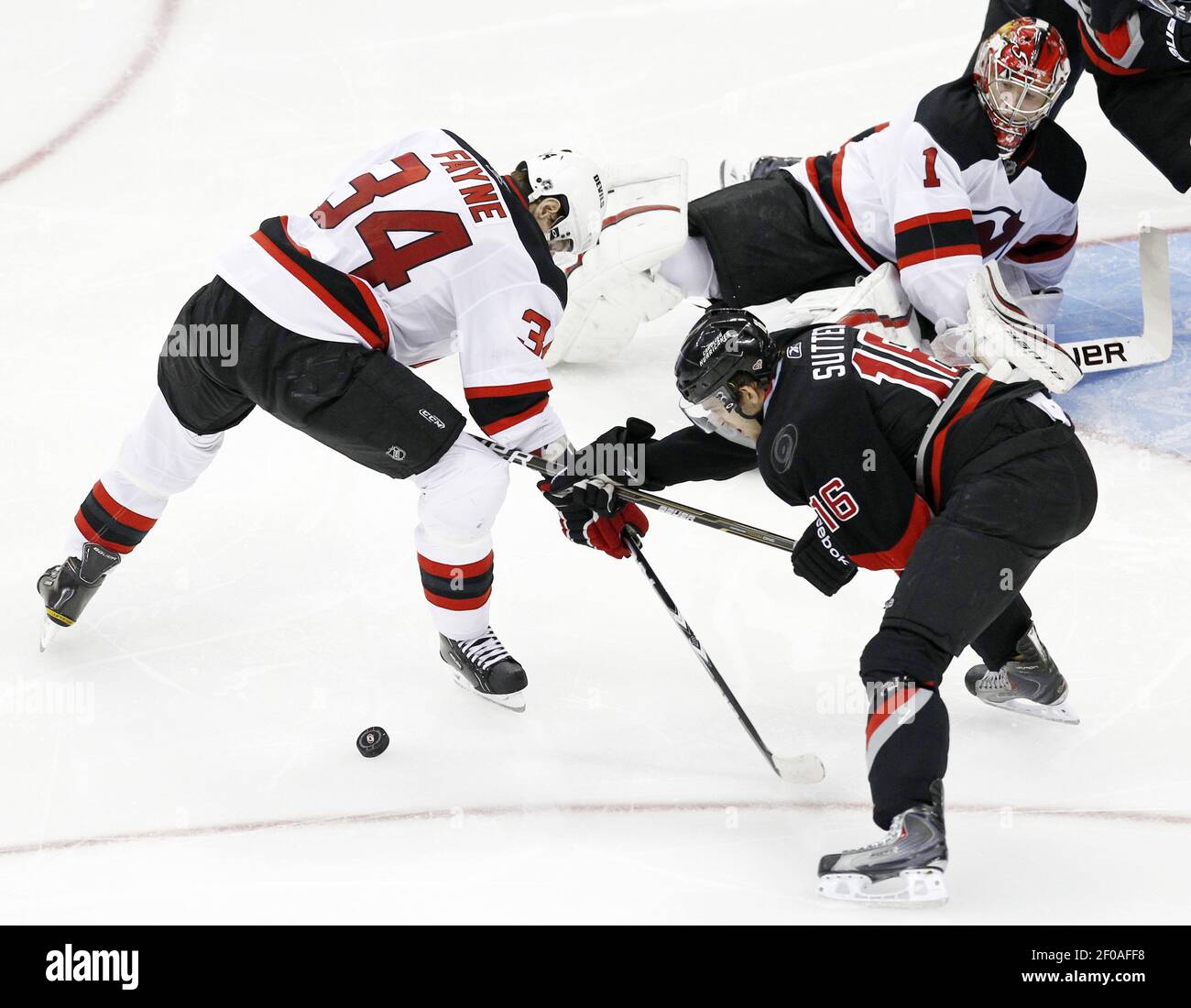 The Carolina Hurricanes' Brandon Sutter (16) battles the New Jersey ...