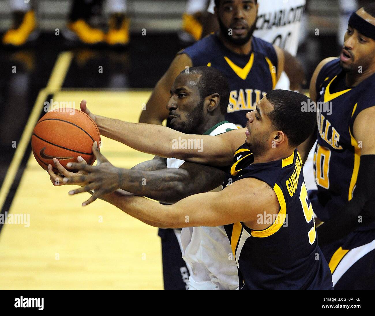 UNC Charlotte's An'Juan Wilderness battles for control of a loose ball ...