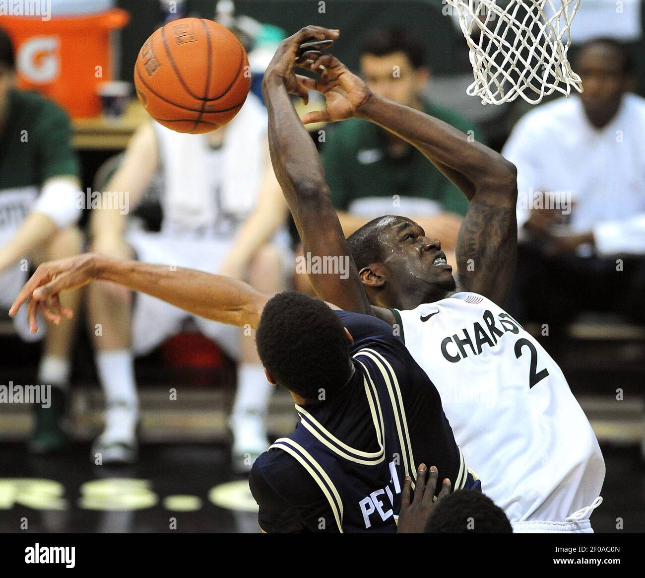 Charlotte's KJ Sherrill, right, loses control of the ball under ...
