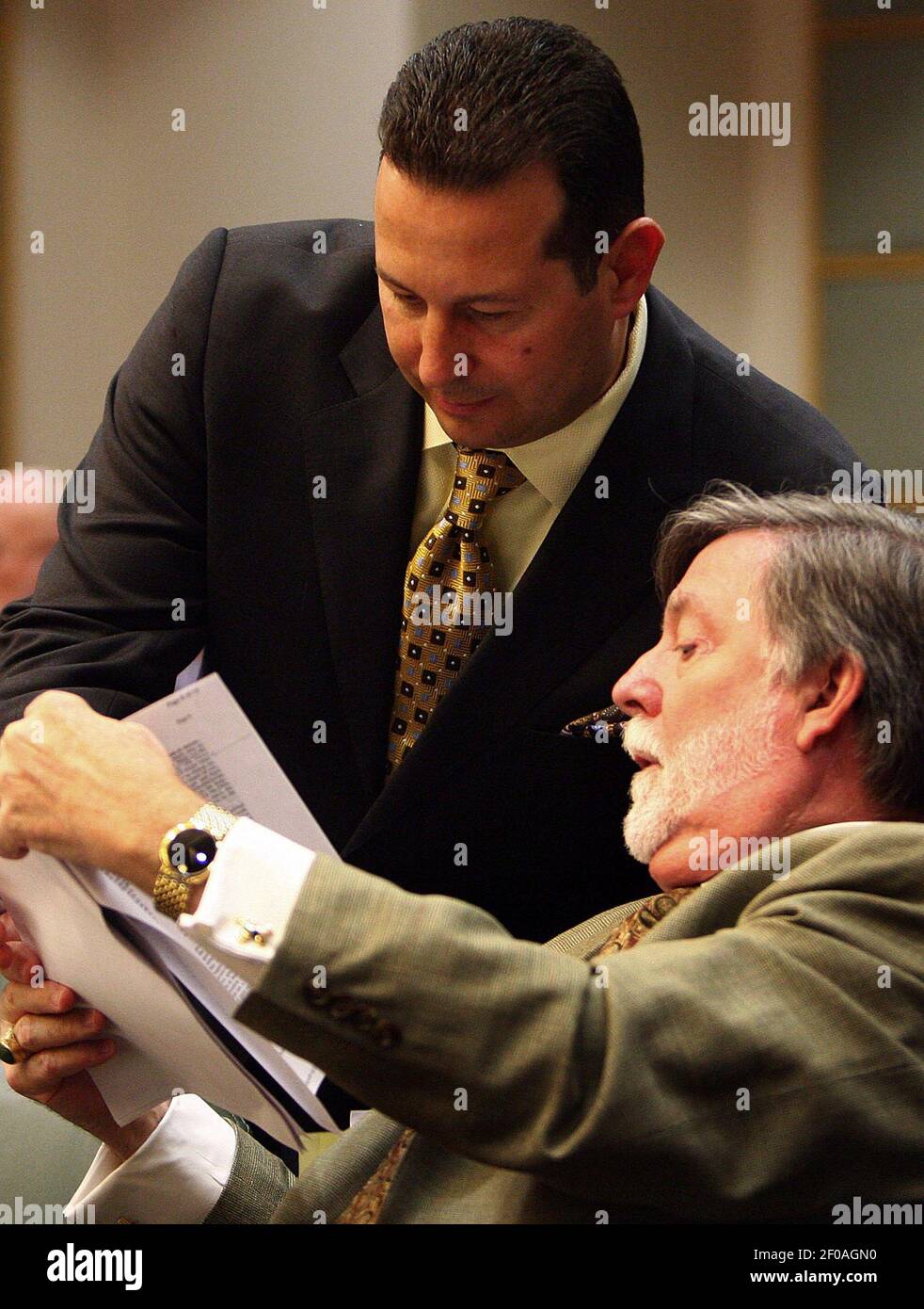 Jose Baez, left, and Cheney Mason, lawyers for Casey Anthony, confer ...
