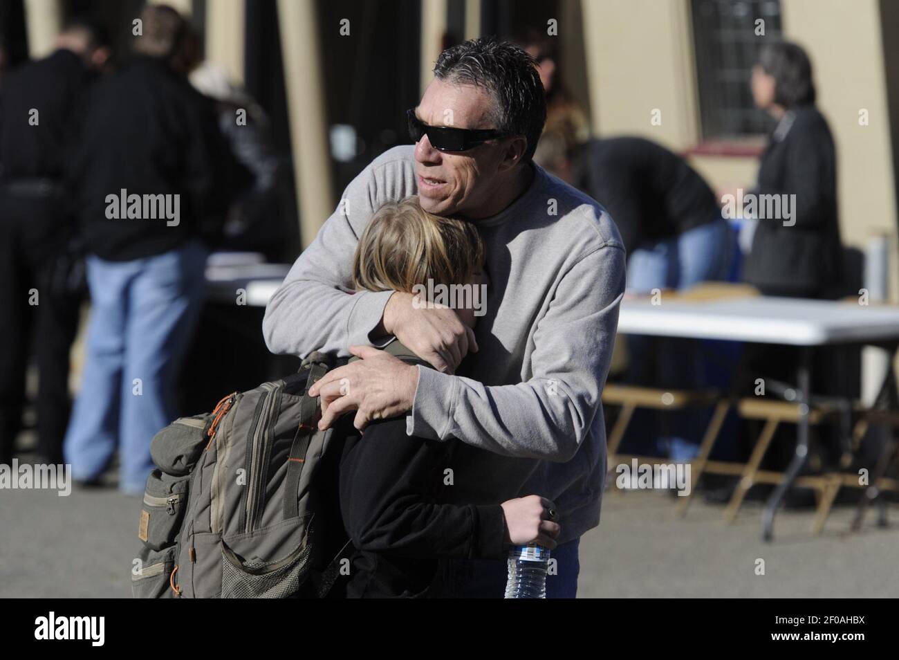 Ron Andersen hugs his son, Nick, 11, a sixth-grader at Louisiana ...