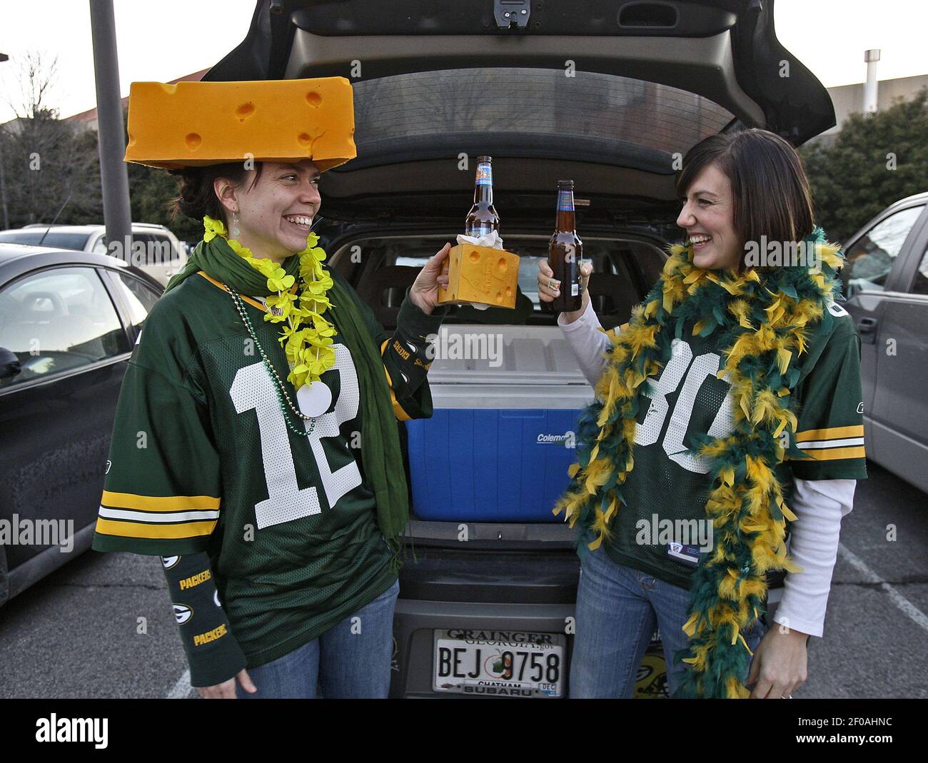 Green Bay Packers fans Sarah Barlow, left, and Laurie Leaf toast before ...
