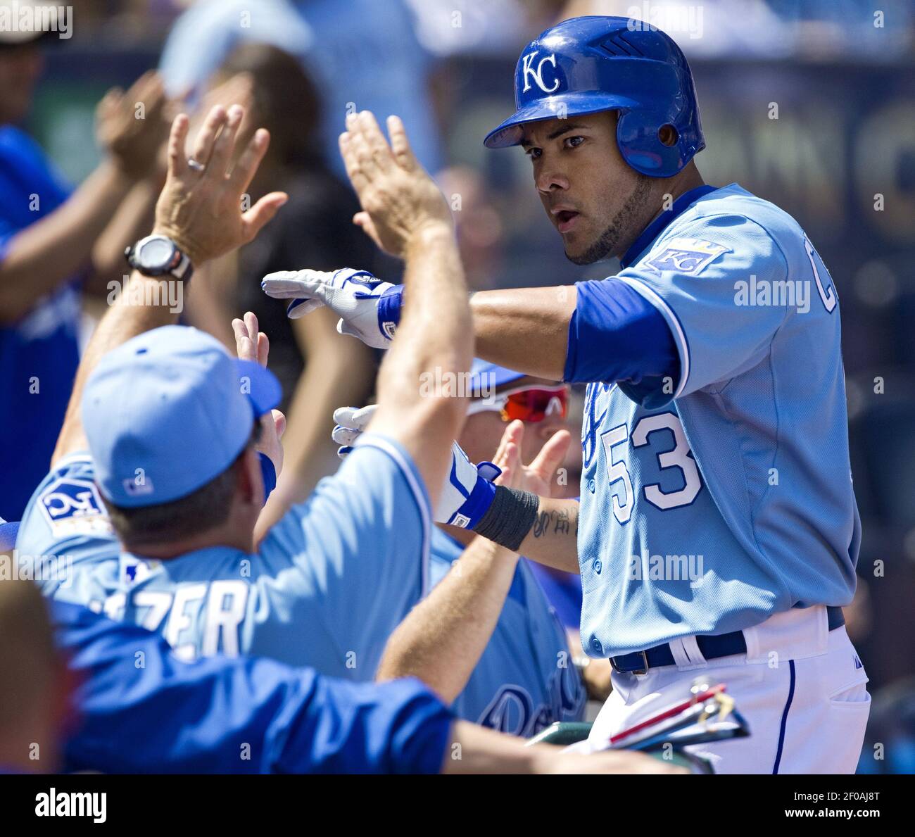 Kansas City Royals' Melky Cabrera (53) is met by teammates after ...