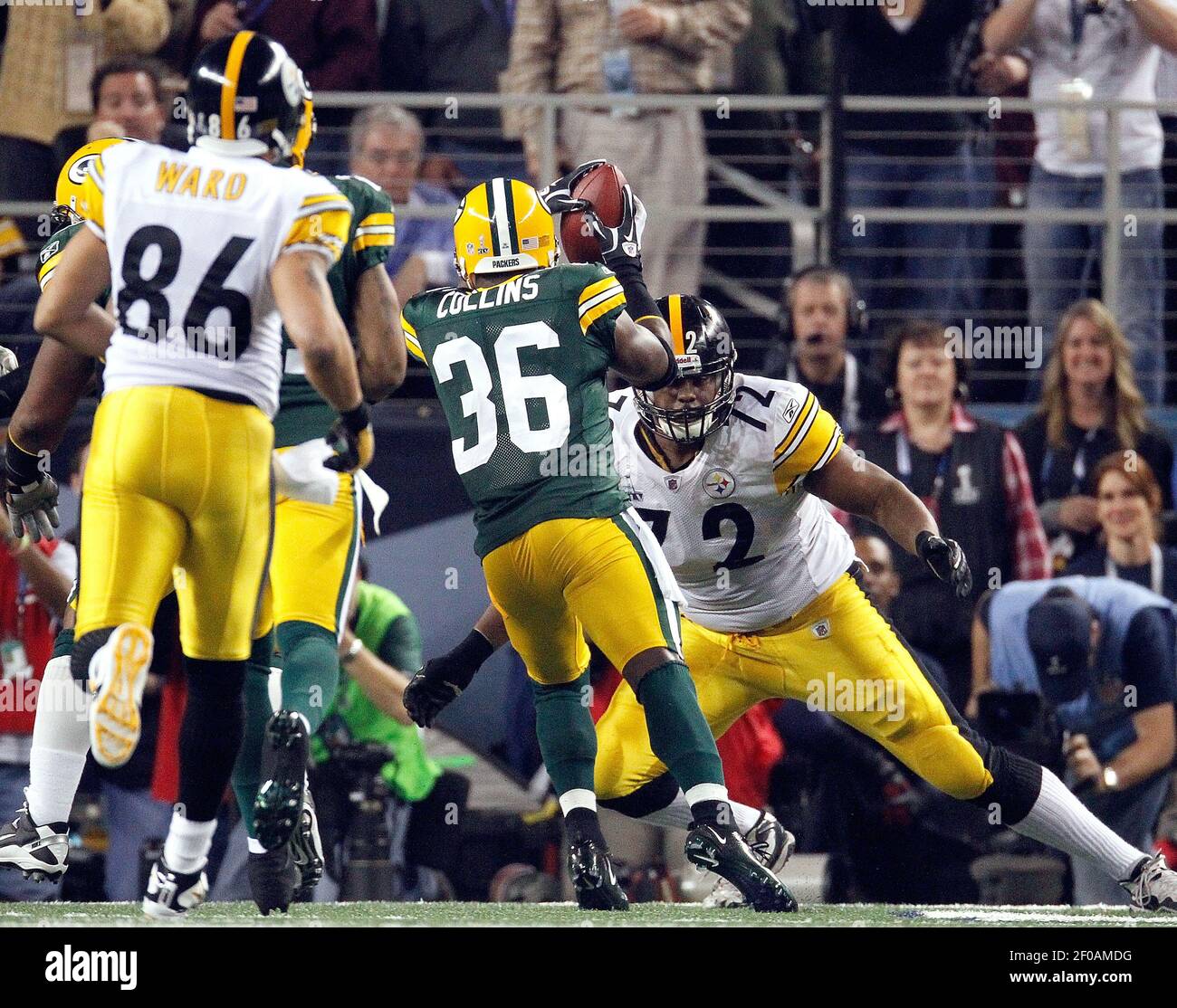Green Bay Packers safety Nick Collins (36) intercepts and returns the ...