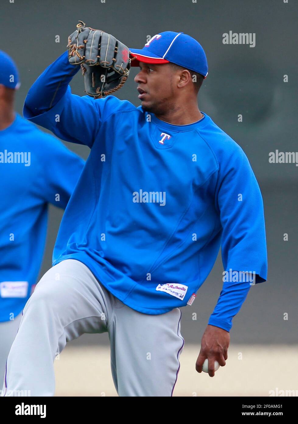 Texas Rangers center fielder Julio Borbon works out with his teammates ...