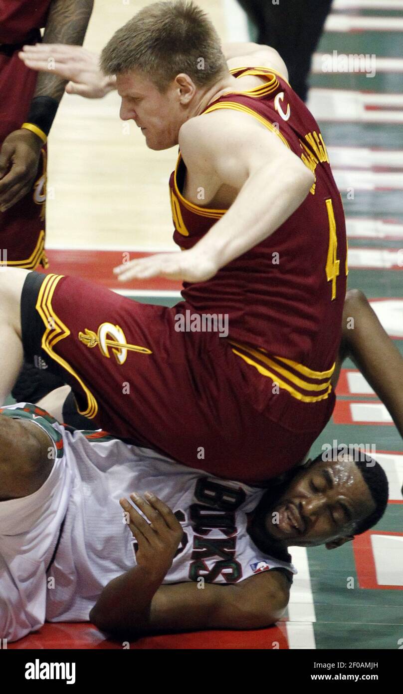 Milwaukee Bucks' Luc Richard Mbah a Moute, bottom, is fouled by the ...