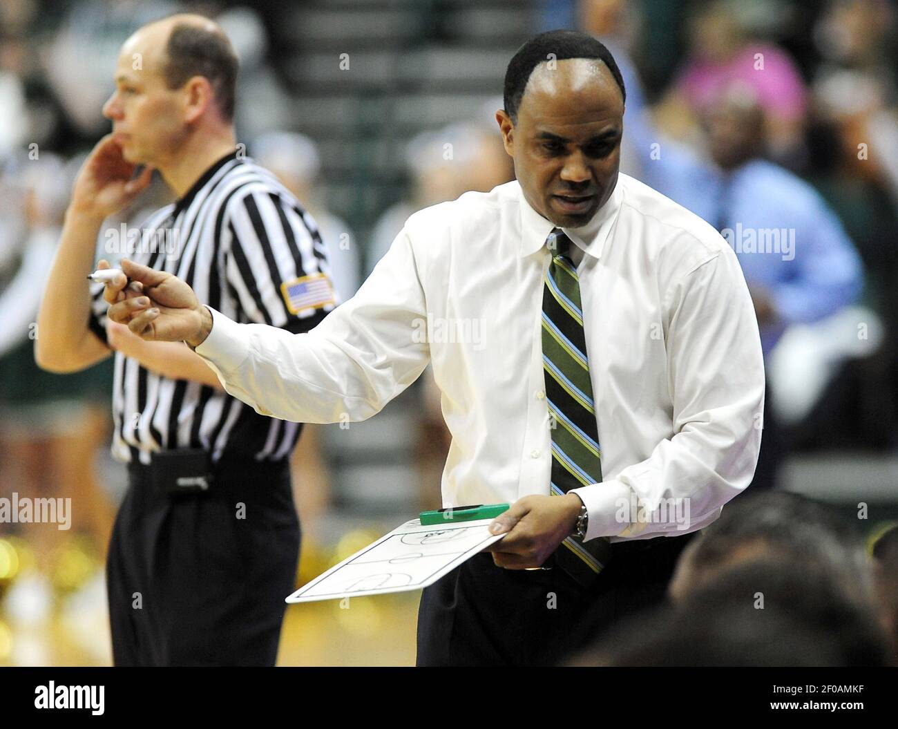 Charlotte head coach Alan Major, right, talks with his staff on the ...