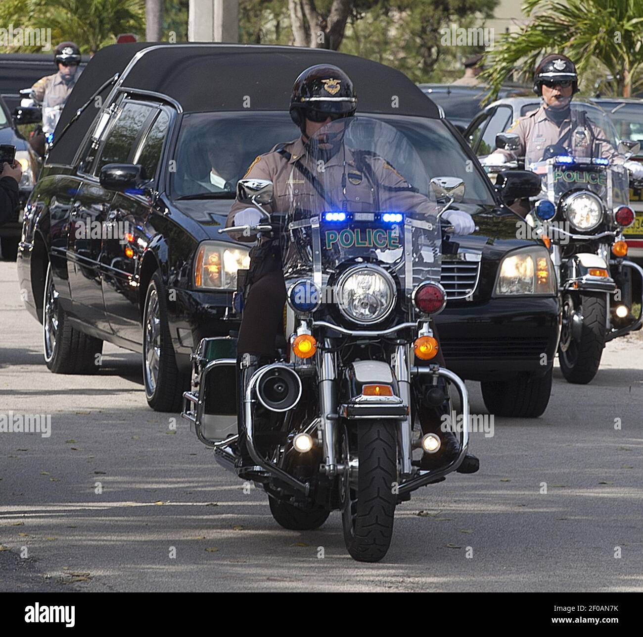 The start of the procession is lead by a Metro Dade motorcycle cop in ...