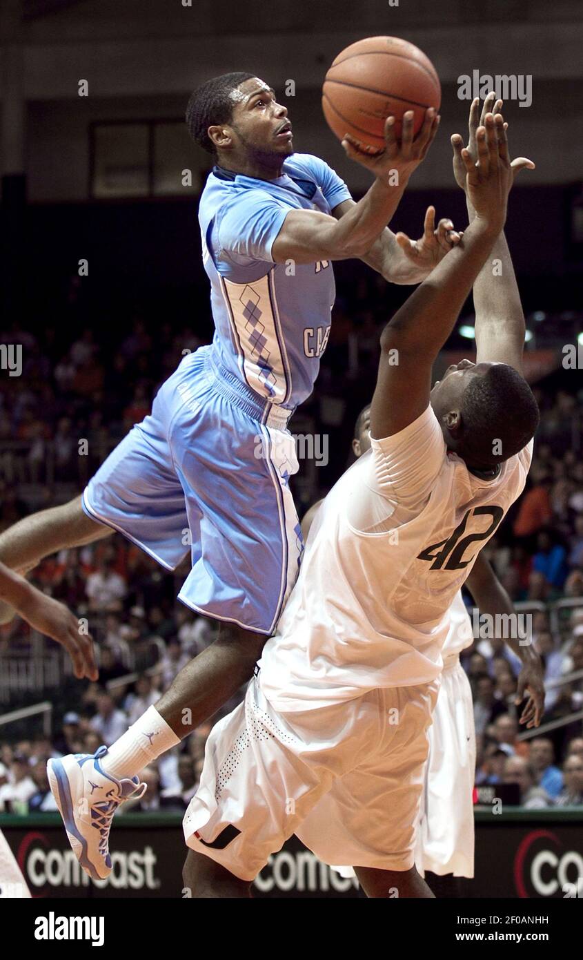 North Carolina's Dexter Strickland (1) drives to the basket and draws a ...