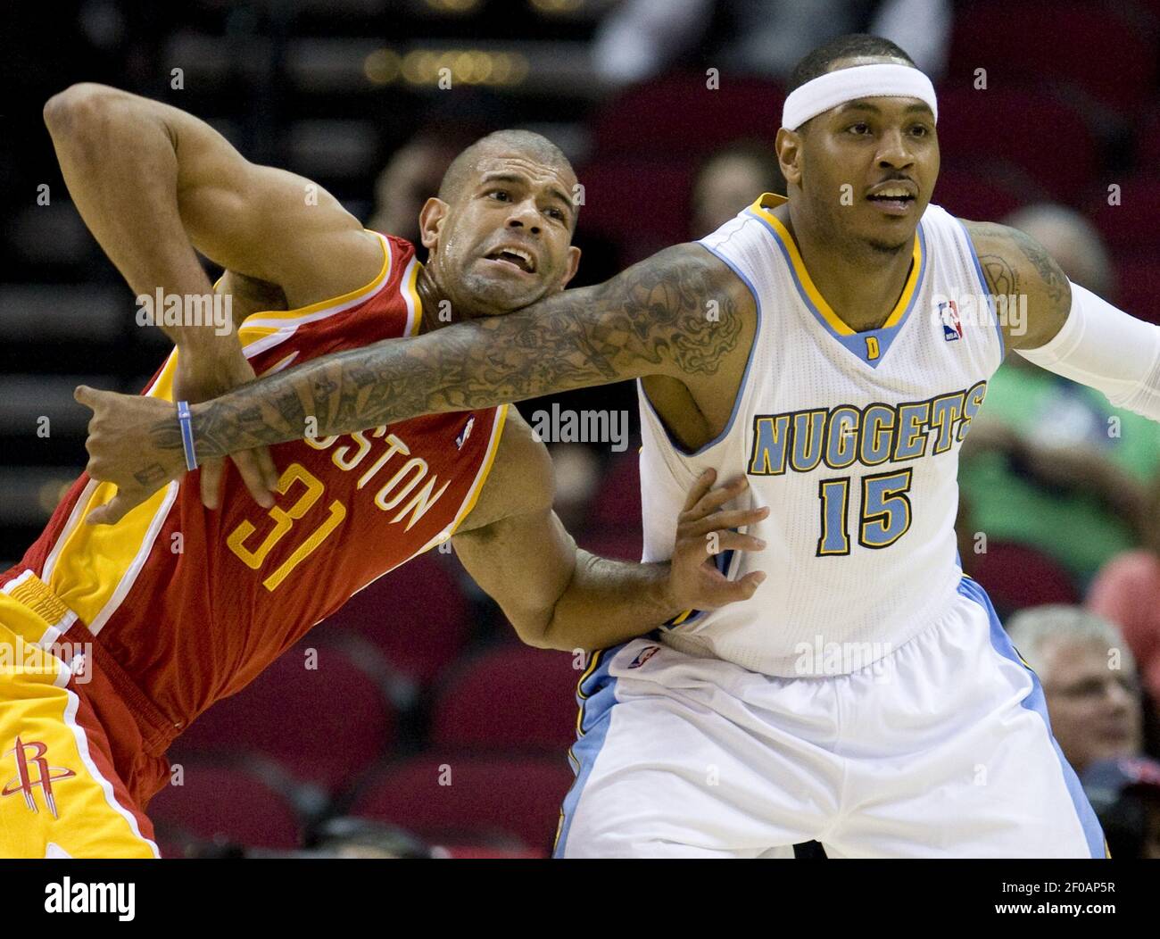 Carmelo Anthony (15) of the Denver Nuggets and Shane Battier (31) of ...