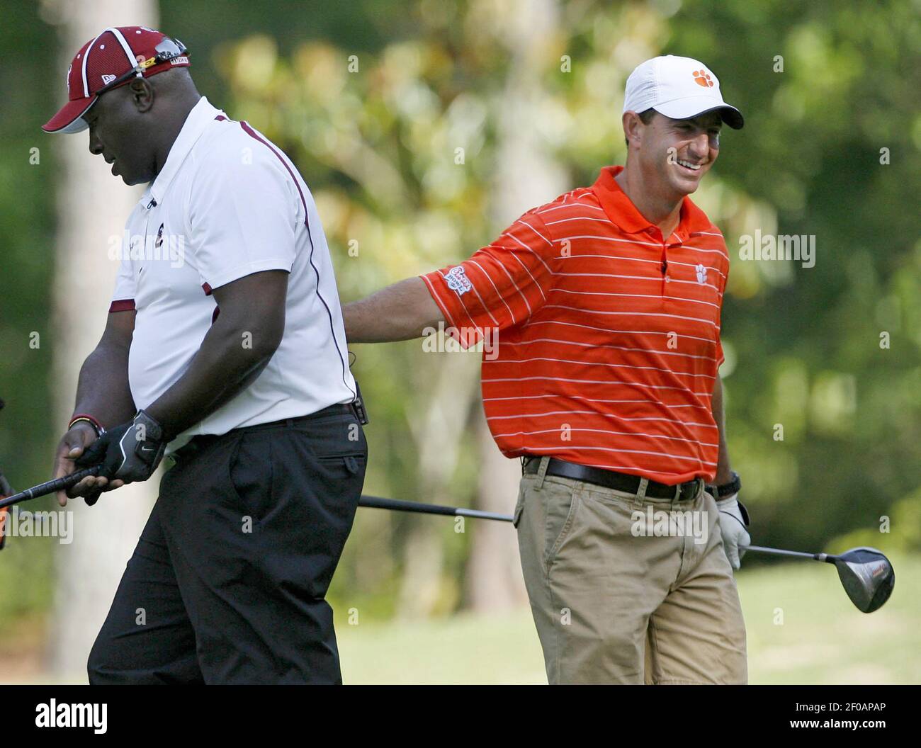 South Carolina football great Sterling Sharpe, left, jokes with Clemson ...
