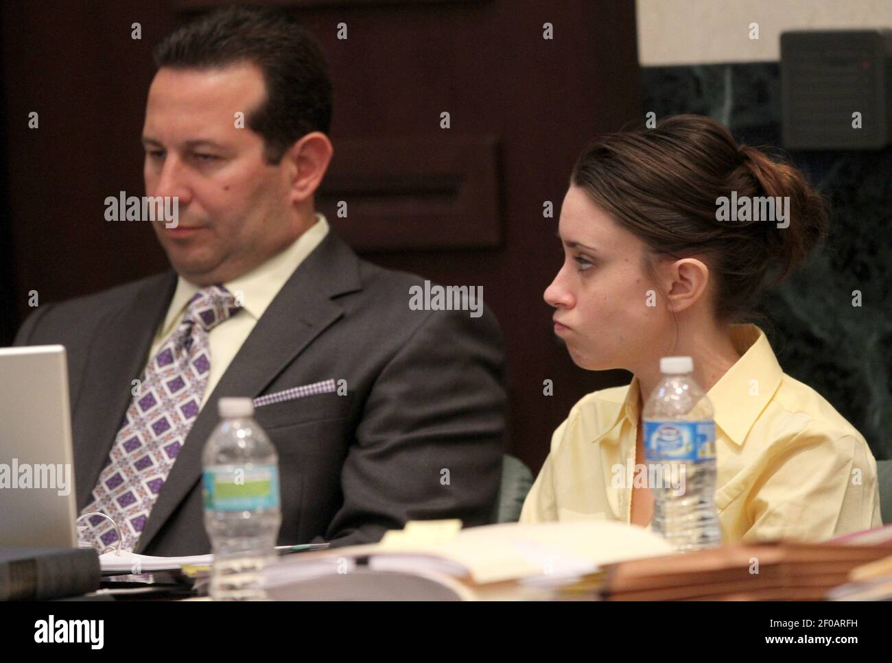 Casey Anthony, right, and her attorney Jose Baez watch a video being ...