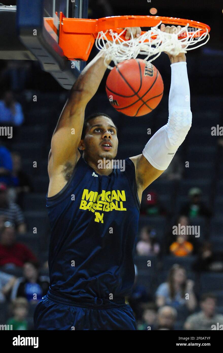 Michigan's Jordan Morgan dunks in practice on Thursday, March 17, 2011 ...