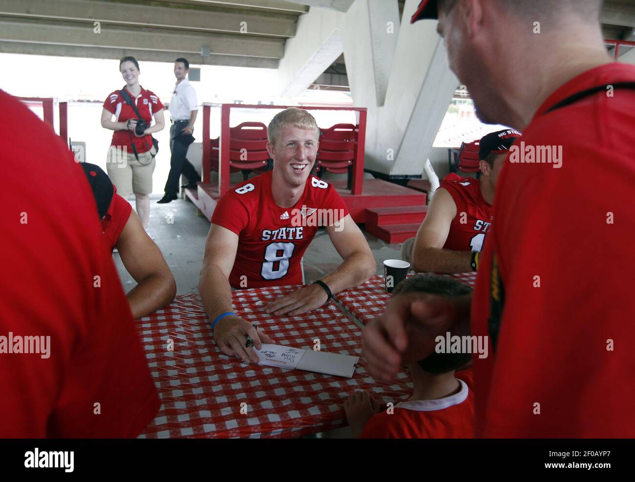 North Carolina State's Mike Glennon (8) greets fans during Meet the ...