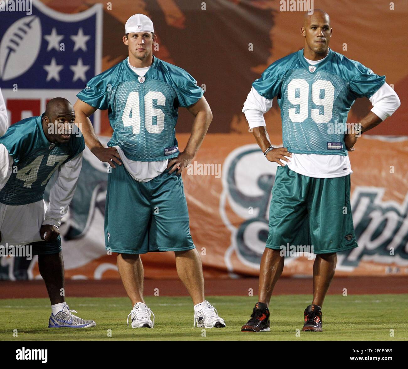 Miami Dolphins Kevin Burnett (47), Jason Trusnik (46) and Jason Taylor ...
