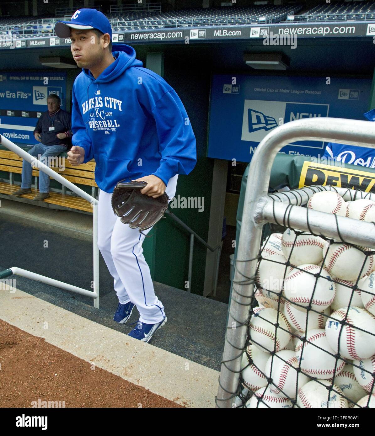 Kansas City Royals pitcher Bruce Chen jogs up the stairs of the dugout ...