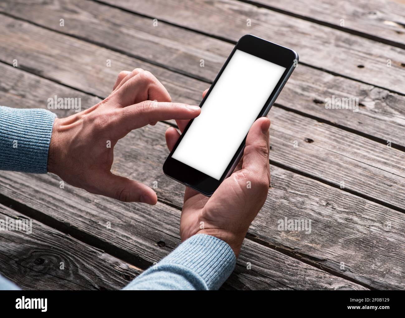 Smartphone in hands. Clipping path included Stock Photo - Alamy