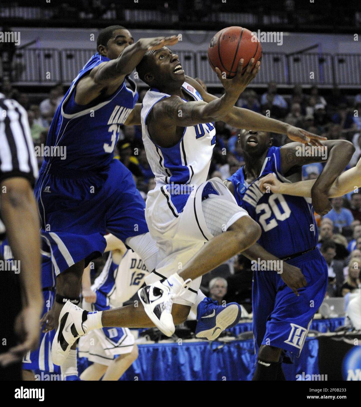 Duke's Nolan Smith (2) drives past Hampton's Koron Reed (33) for a ...