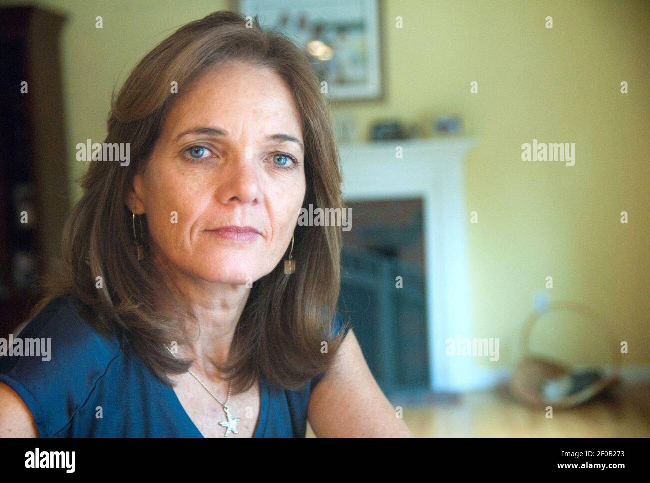 Christie Coombs, shown in her home in Abingdon, Massachusetts, widowed ...