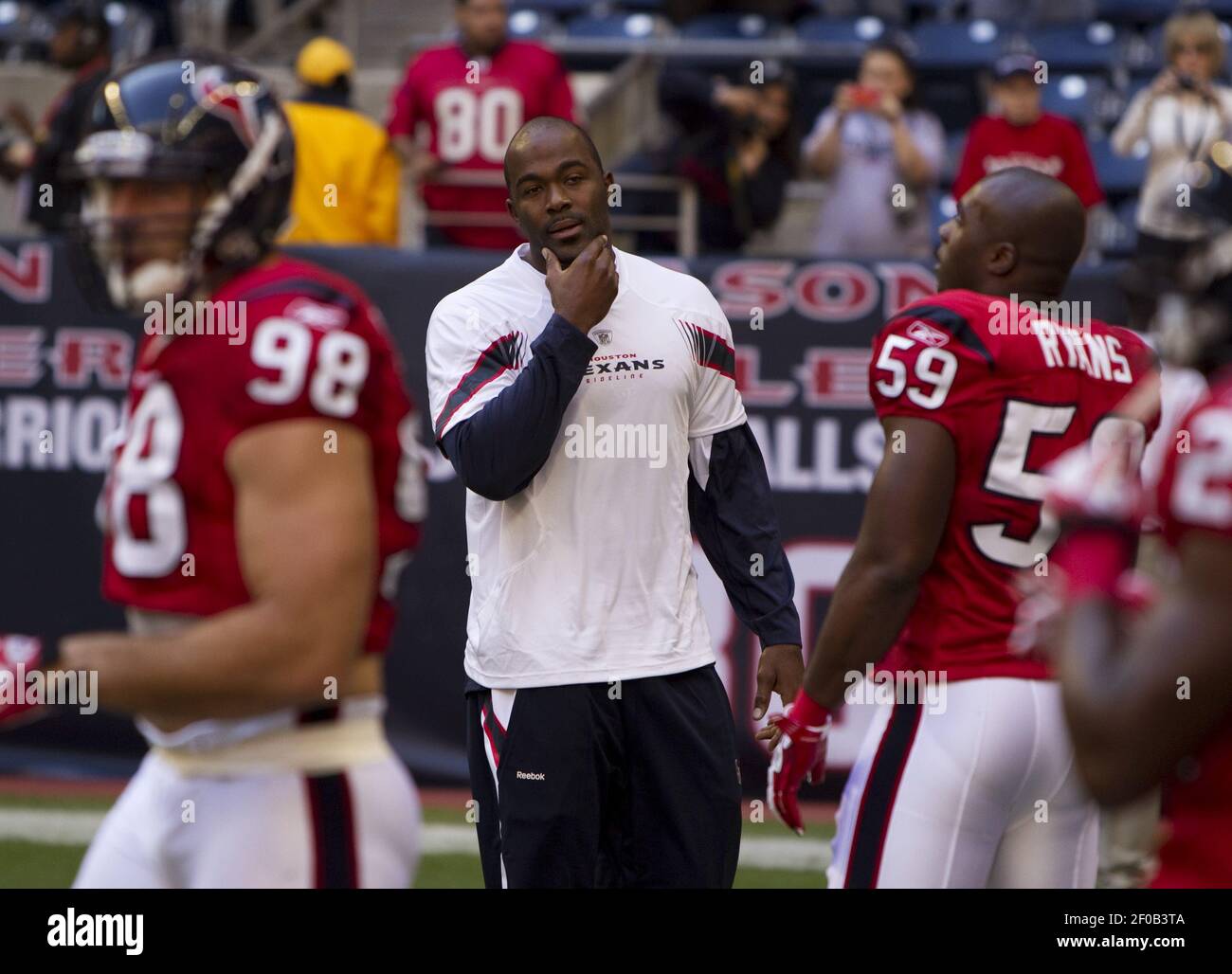 An injured Mario Williams of the Houston Texans stand on the field as ...