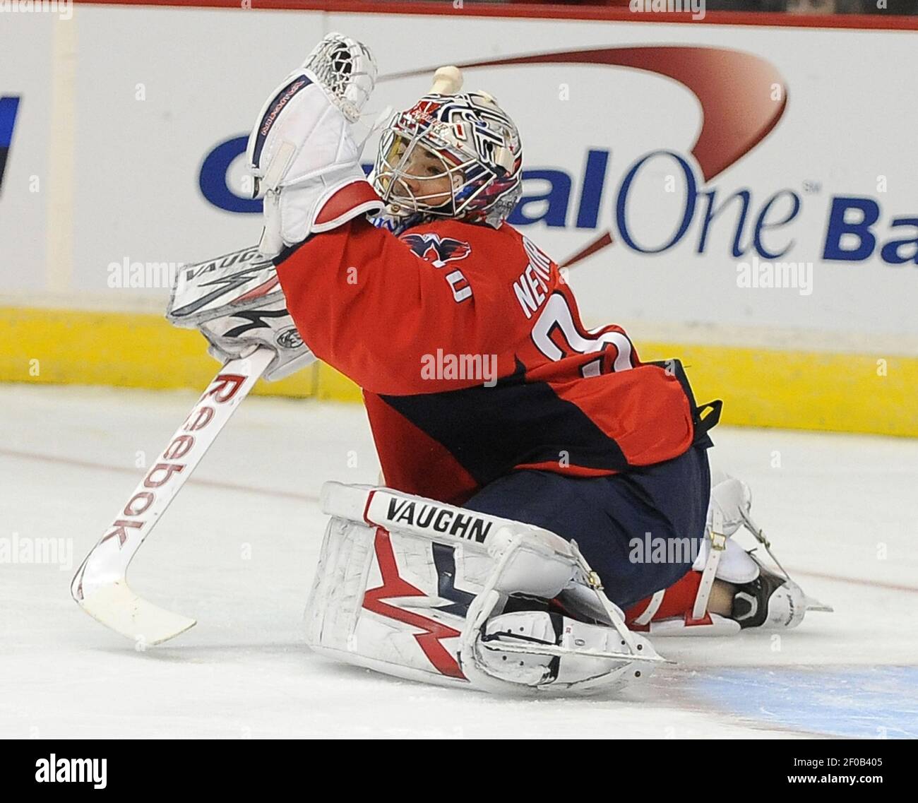 Washington Capitals goalie Michal Neuvirth (30) looks the puck into his ...
