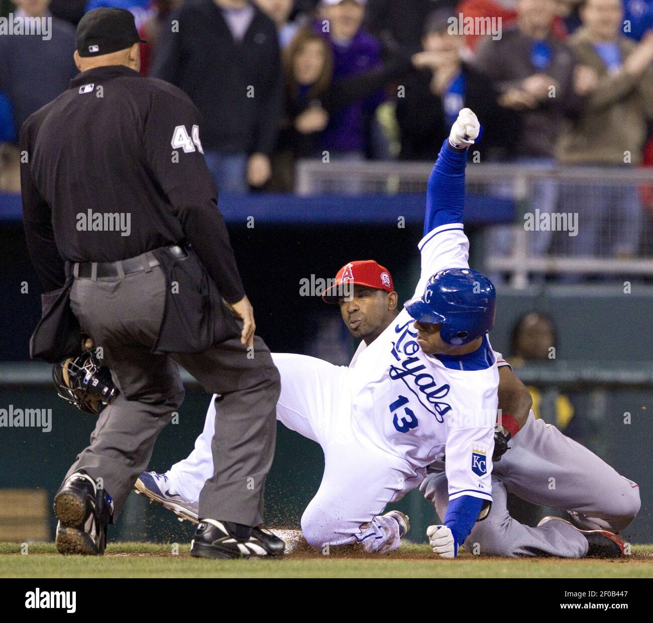 Kansas City Royals' Mike Aviles (13) reaches third base on a triple ...