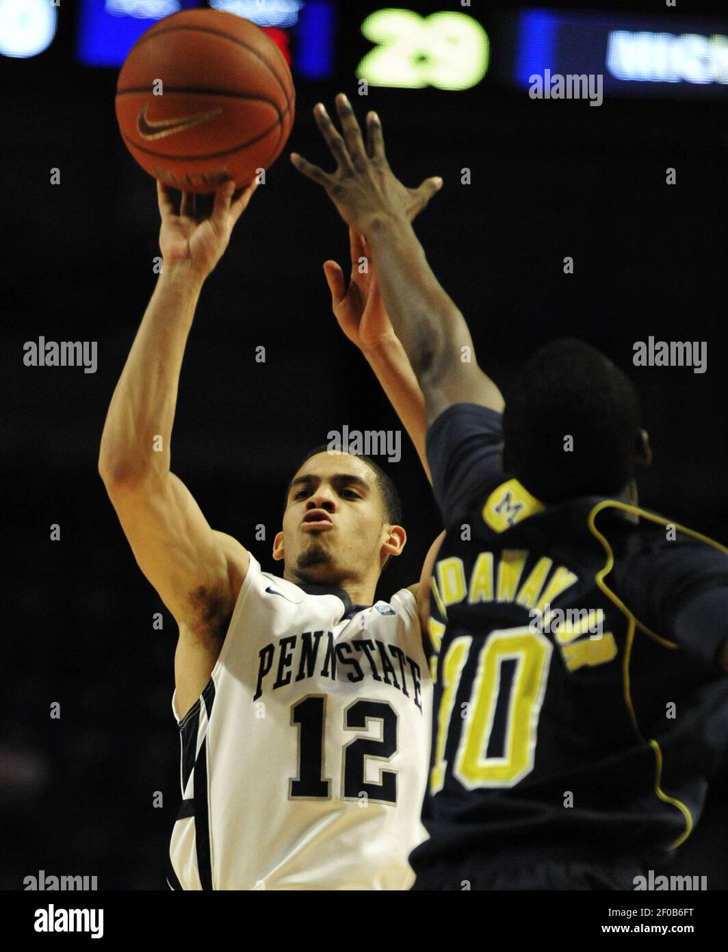 Penn State's Talor Battle shoots over a block from Michigan's Tim ...