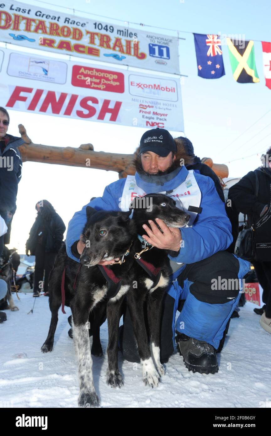 John Baker celebrates with his lead dogs after winning the Iditarod ...