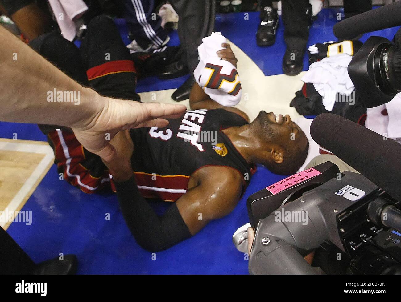 Miami Heat guard Dwyane Wade (3) lies injured during the first half ...
