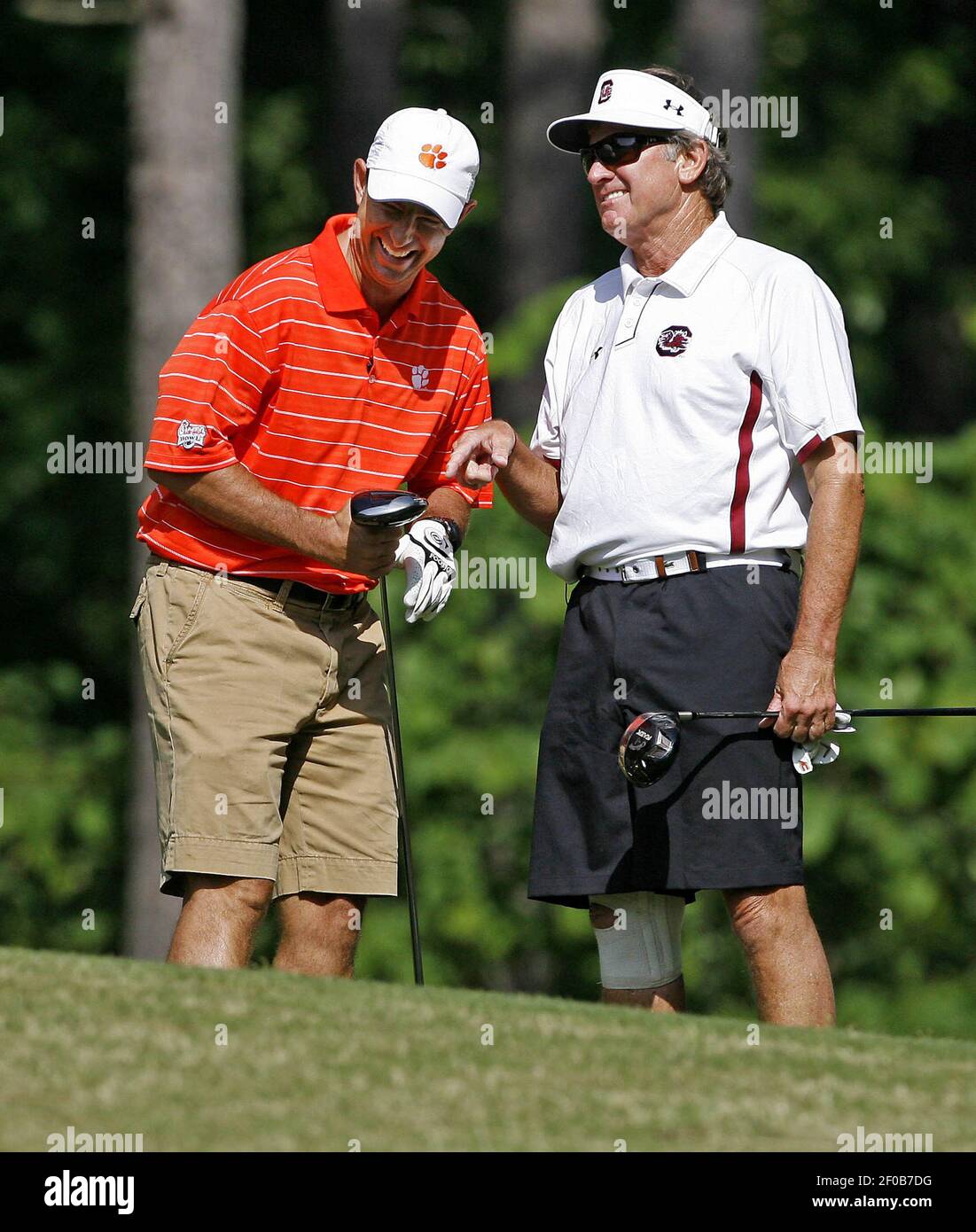 Clemson head football coach Dabo Swinney jokes with South Carolina head ...