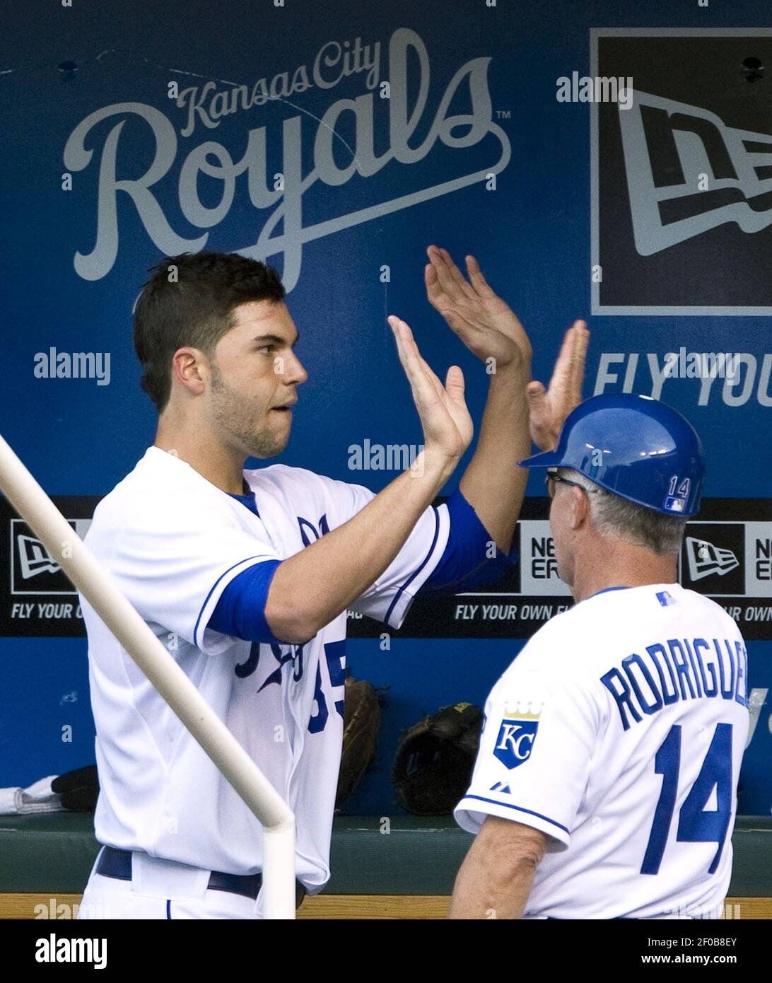 Kansas City Royals first baseman Eric Hosmer (35) is congratulated by ...