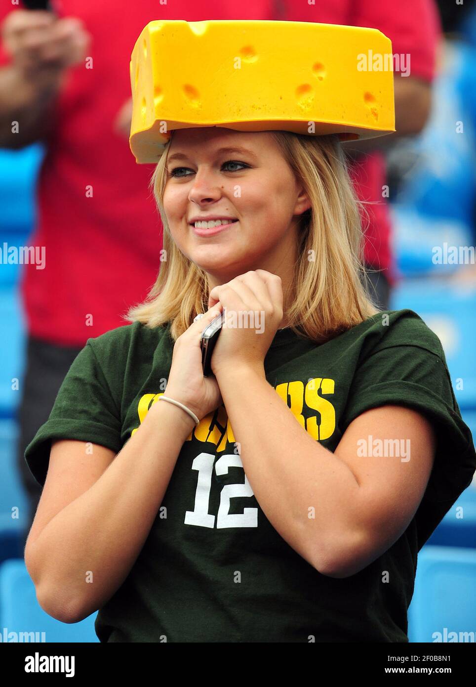 A Green Bay Packers fan beams as the team walks onto the field Sunday ...