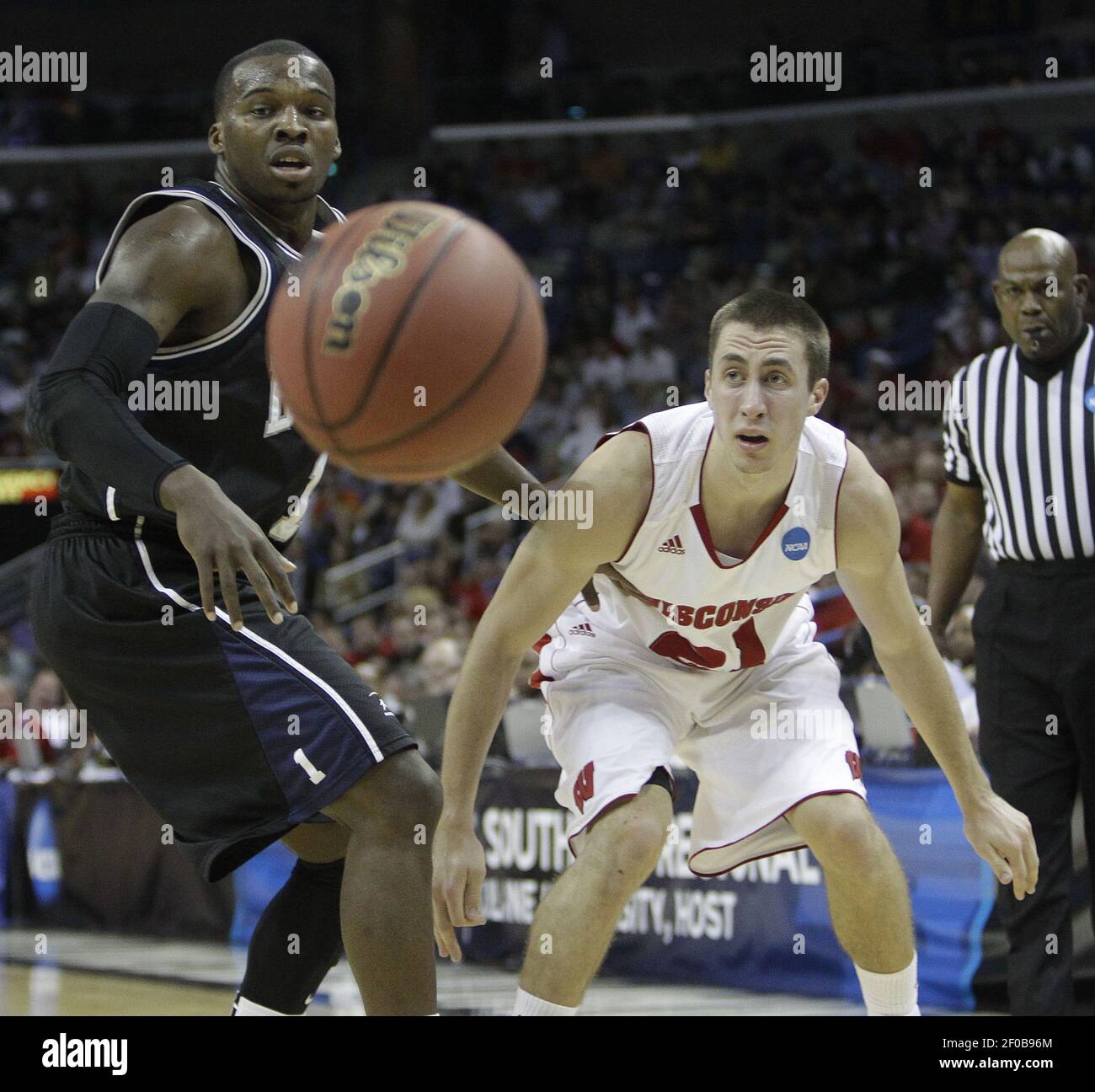 Wisconsin's Josh Gasser, right, dislodges the ball from Butler's Ronald ...