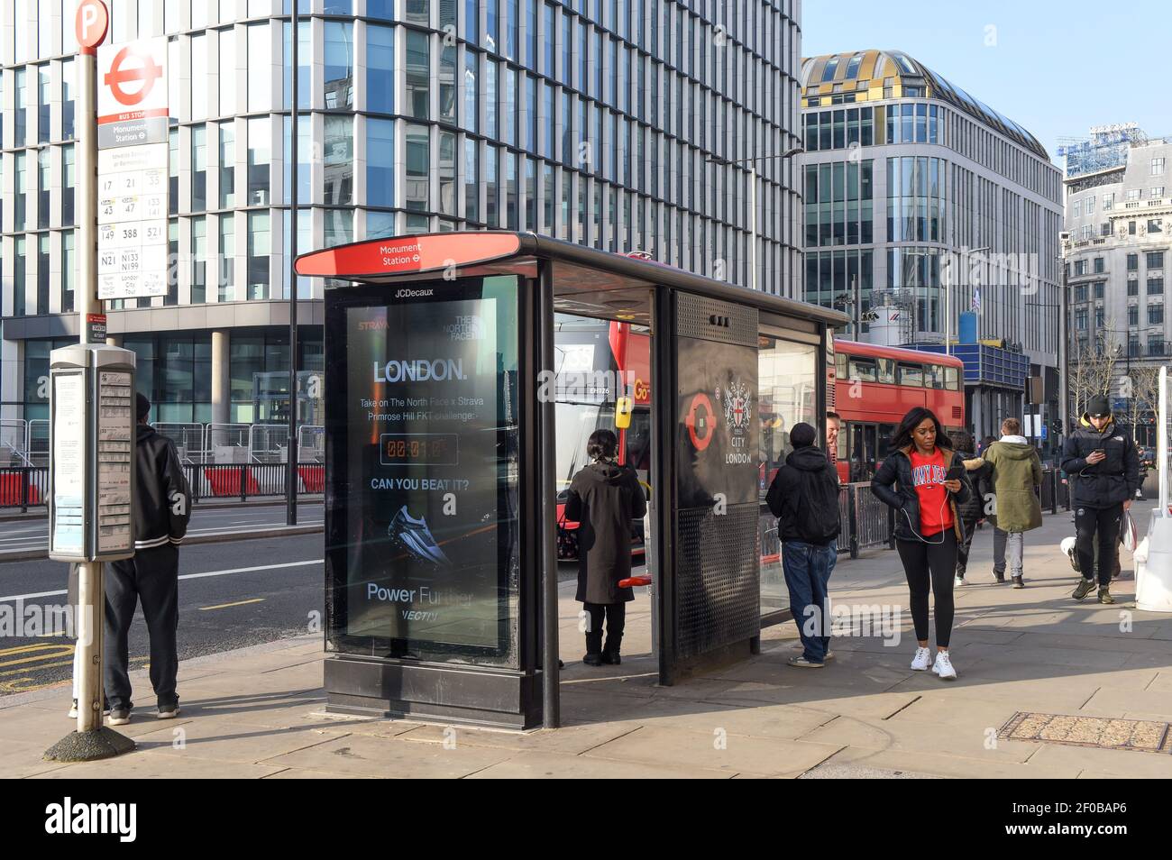 London, UK. 2nd Mar, 2021. Commuters waiting for the bus at the bus ...