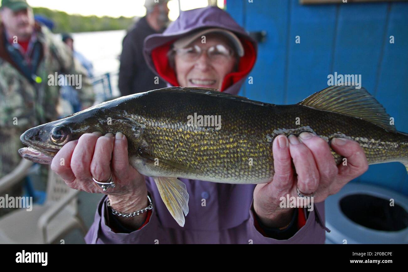 Margaret Koolman, 86, of Bloomington, holds up a 23-inch walleye she ...