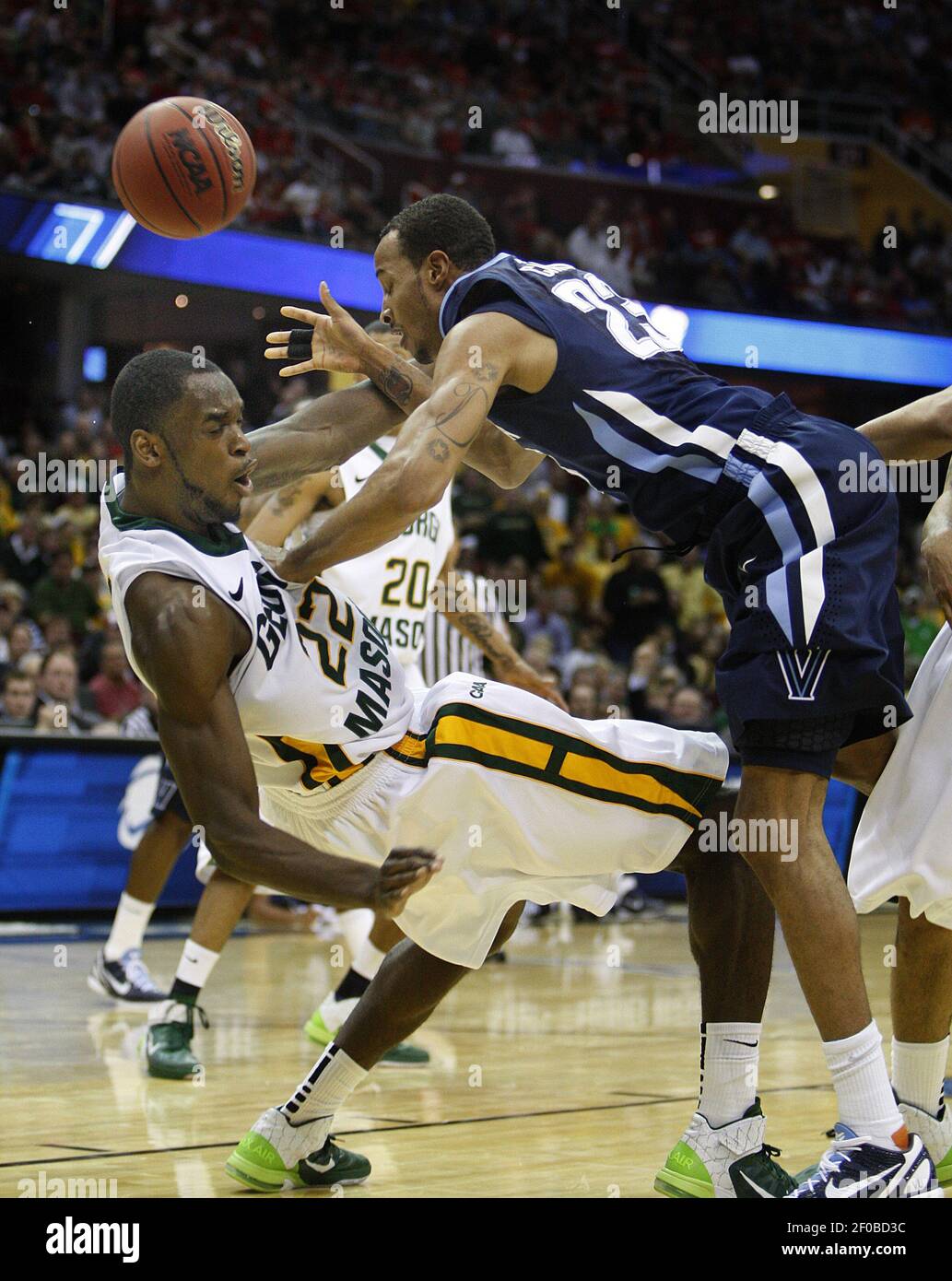 George Mason's Mike Morrison, left, draws the charge call on Villanova ...