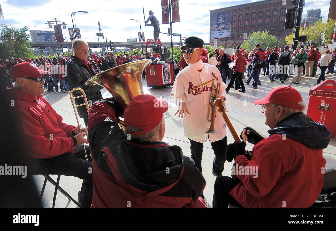 Members of the Red Bird Stompers entertain the crowd before Game 2 of ...