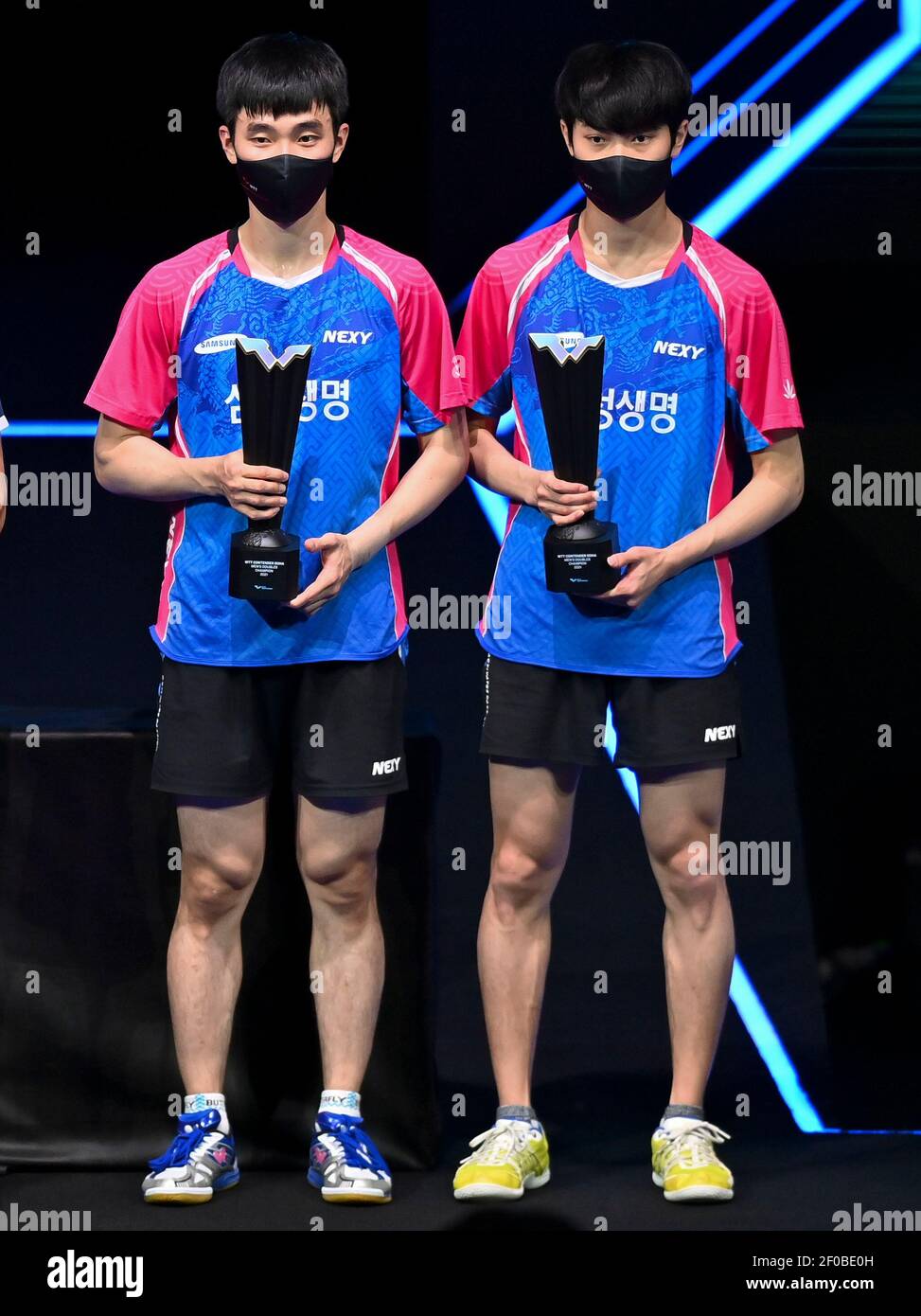 Doha. 6th Mar, 2021. Cho Daeseong (R) and Lee Sangsu of South Korea ...